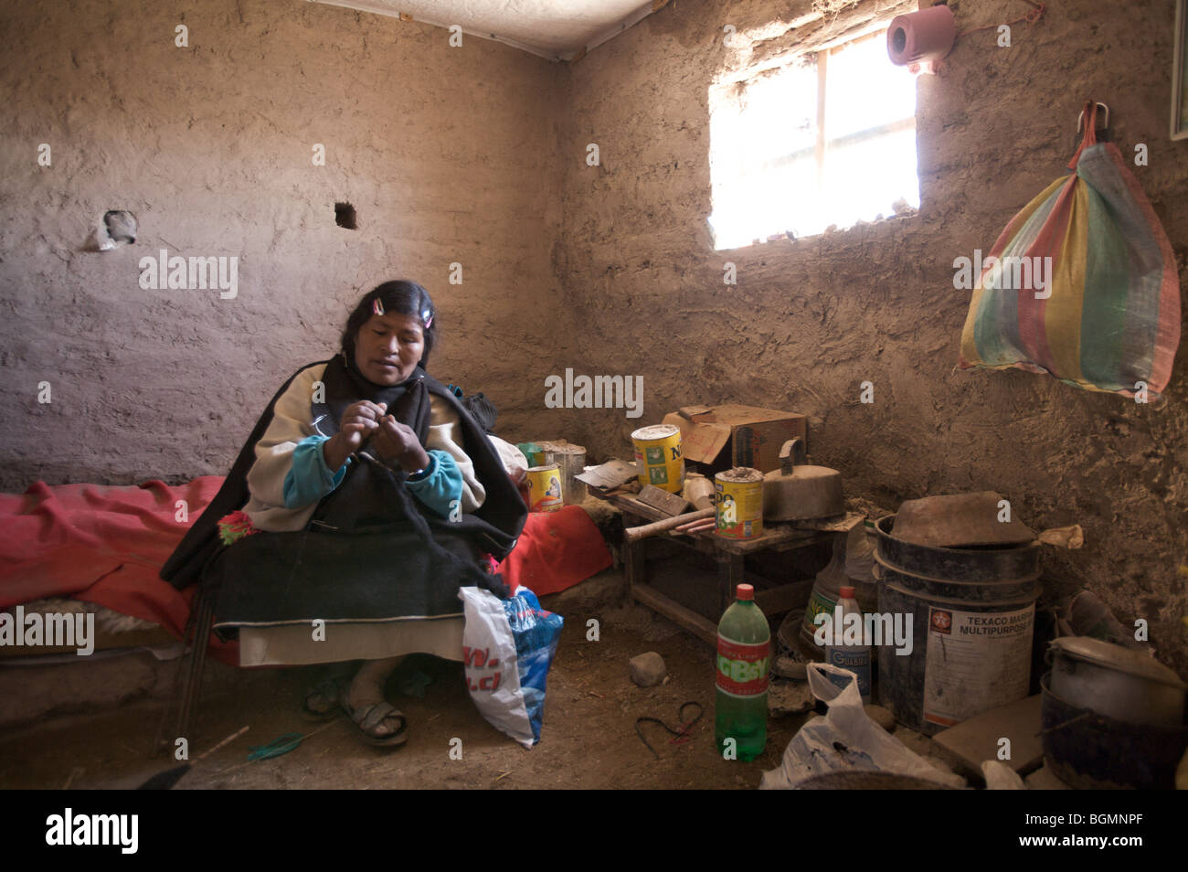 A Chipaya woman knitting in her house Stock Photo - Alamy