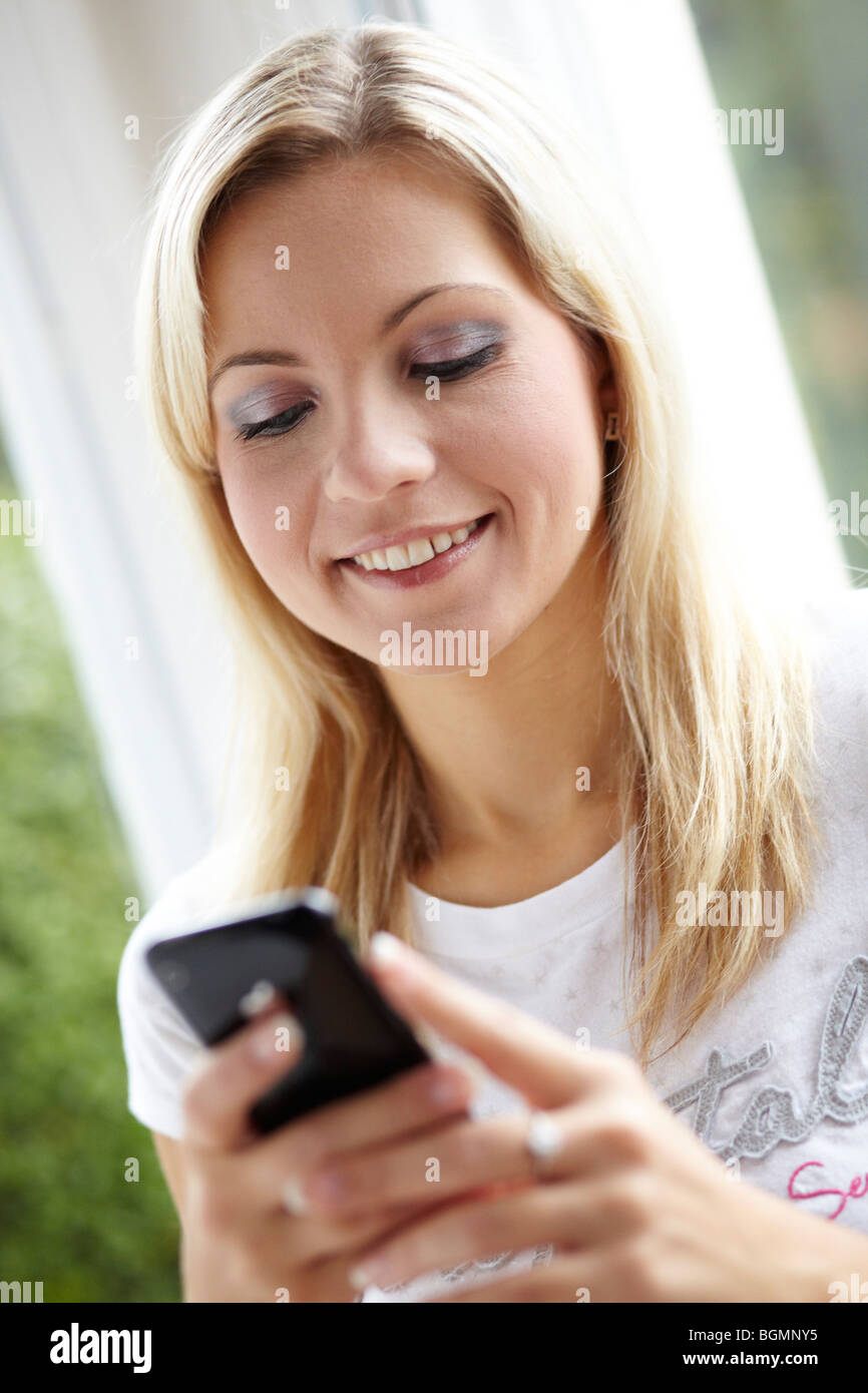Girl using iPhone Stock Photo - Alamy