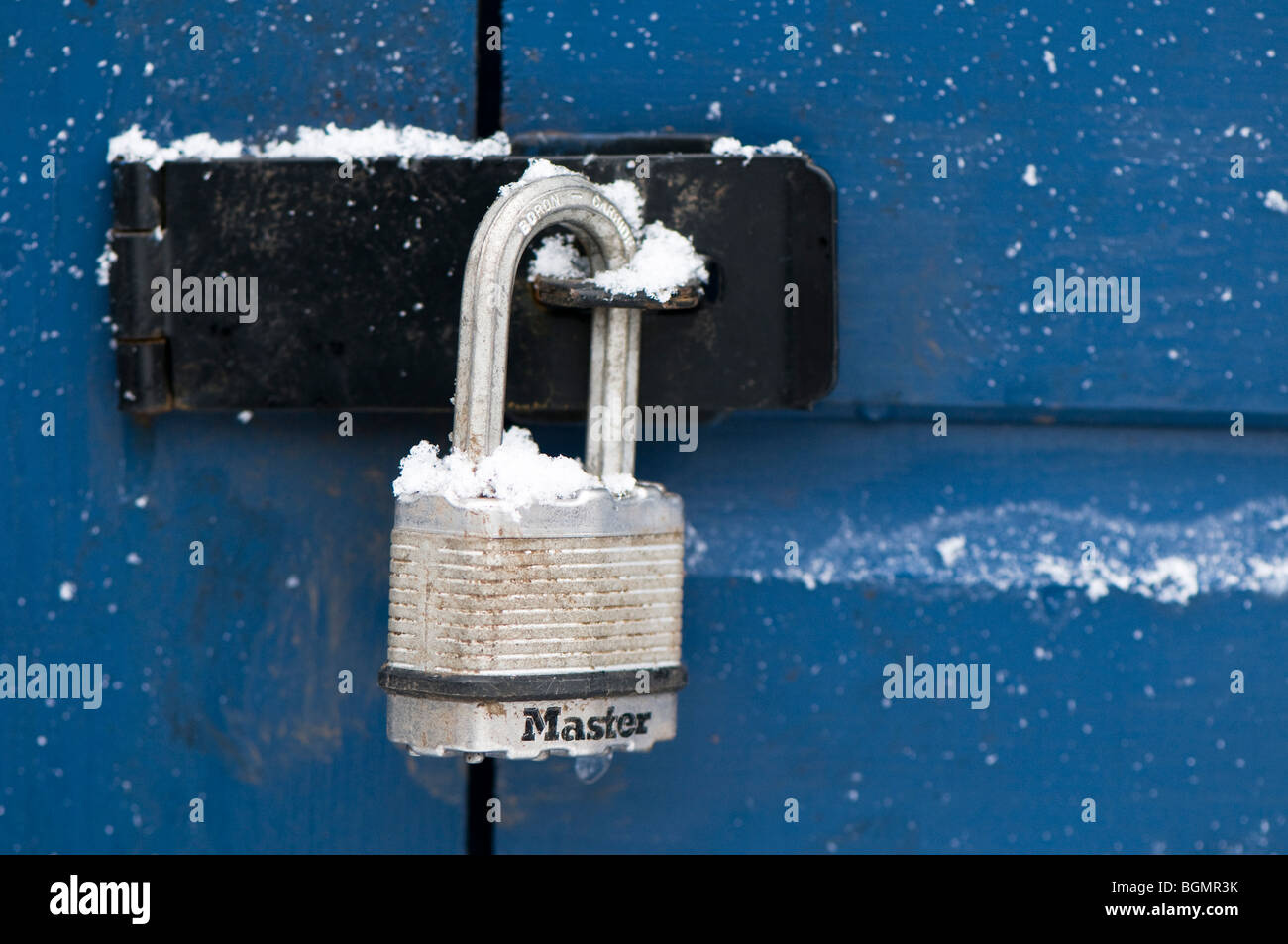 Close up of a padlock in the snow Stock Photo - Alamy