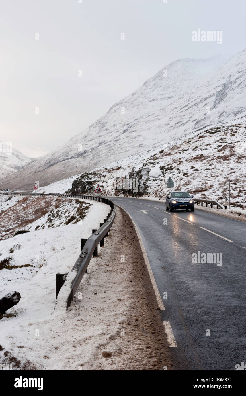 Car driving in snow on A82 in Scotland Stock Photo - Alamy
