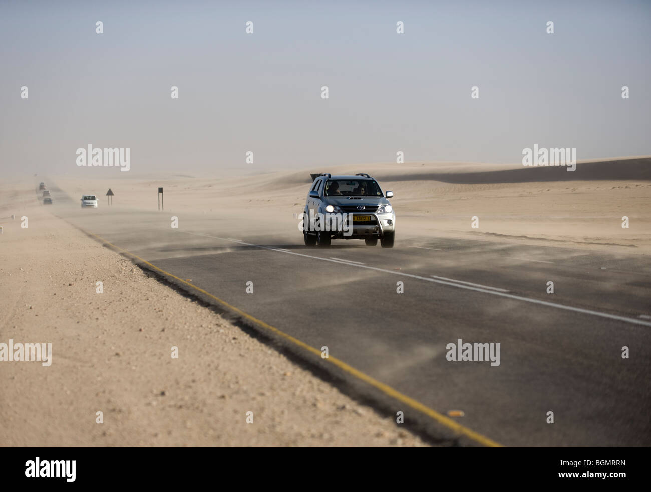 Driving along a road through the namibian desert Stock Photo - Alamy