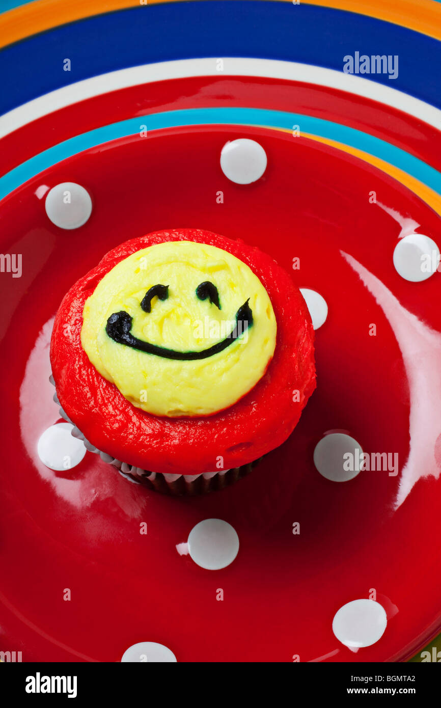 Smiley face cupcake Stock Photo - Alamy