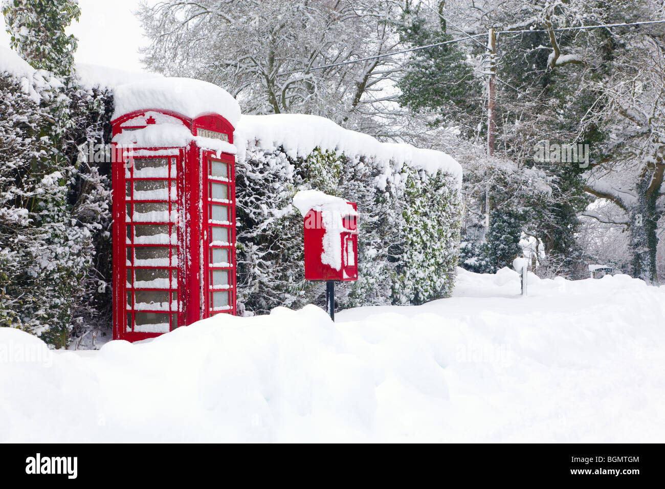 A red British telephone and post box in the snow Stock Photo - Alamy