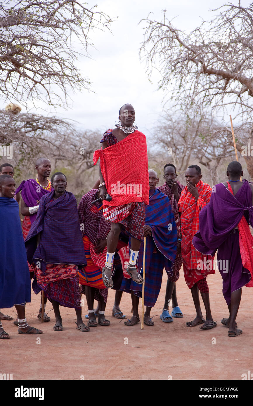 Masai Warriors Performing A Welcome Dance In Traditiona Red And Bluel