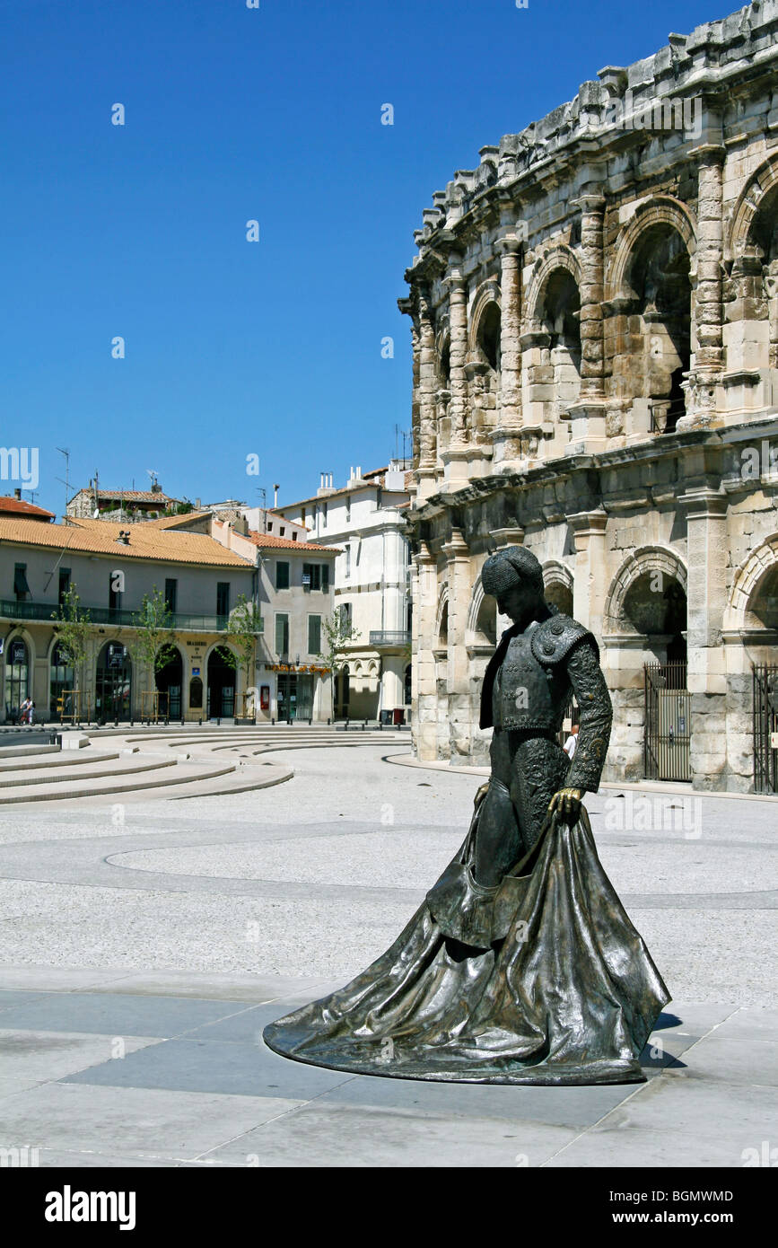 Statue of matador and ancient Roman empire amphitheatre, Nimes ...