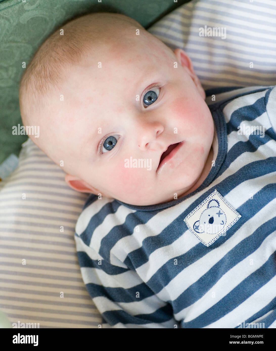 Baby lying on his back Stock Photo - Alamy