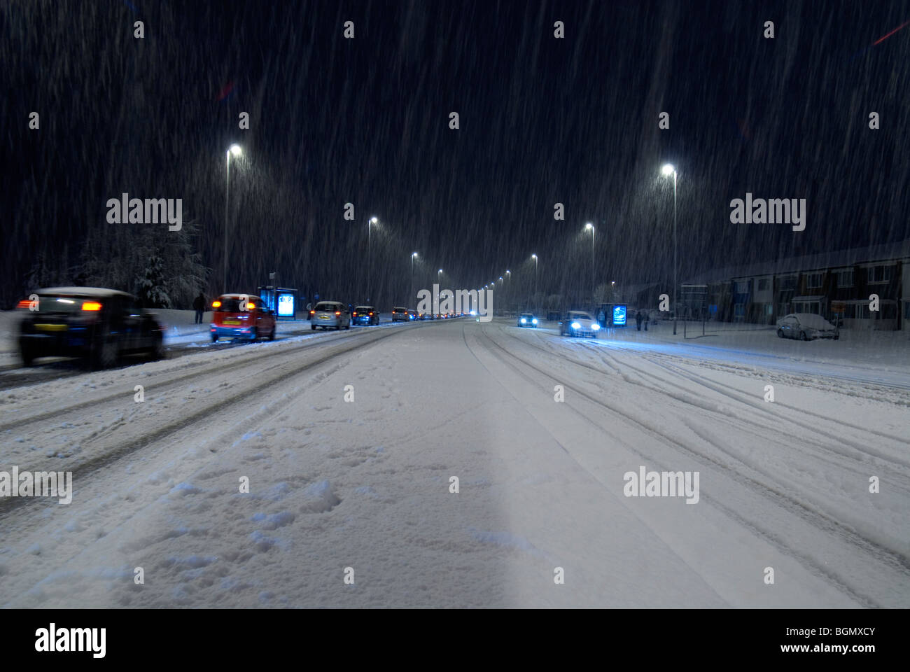 cars driving at night in the snow Stock Photo - Alamy