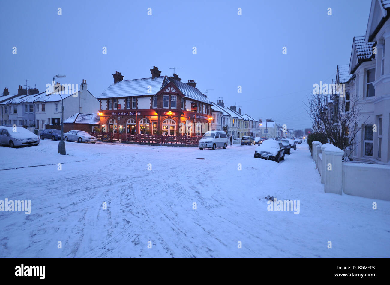 Snow on a residential street in the evening, Sussex, England Stock ...