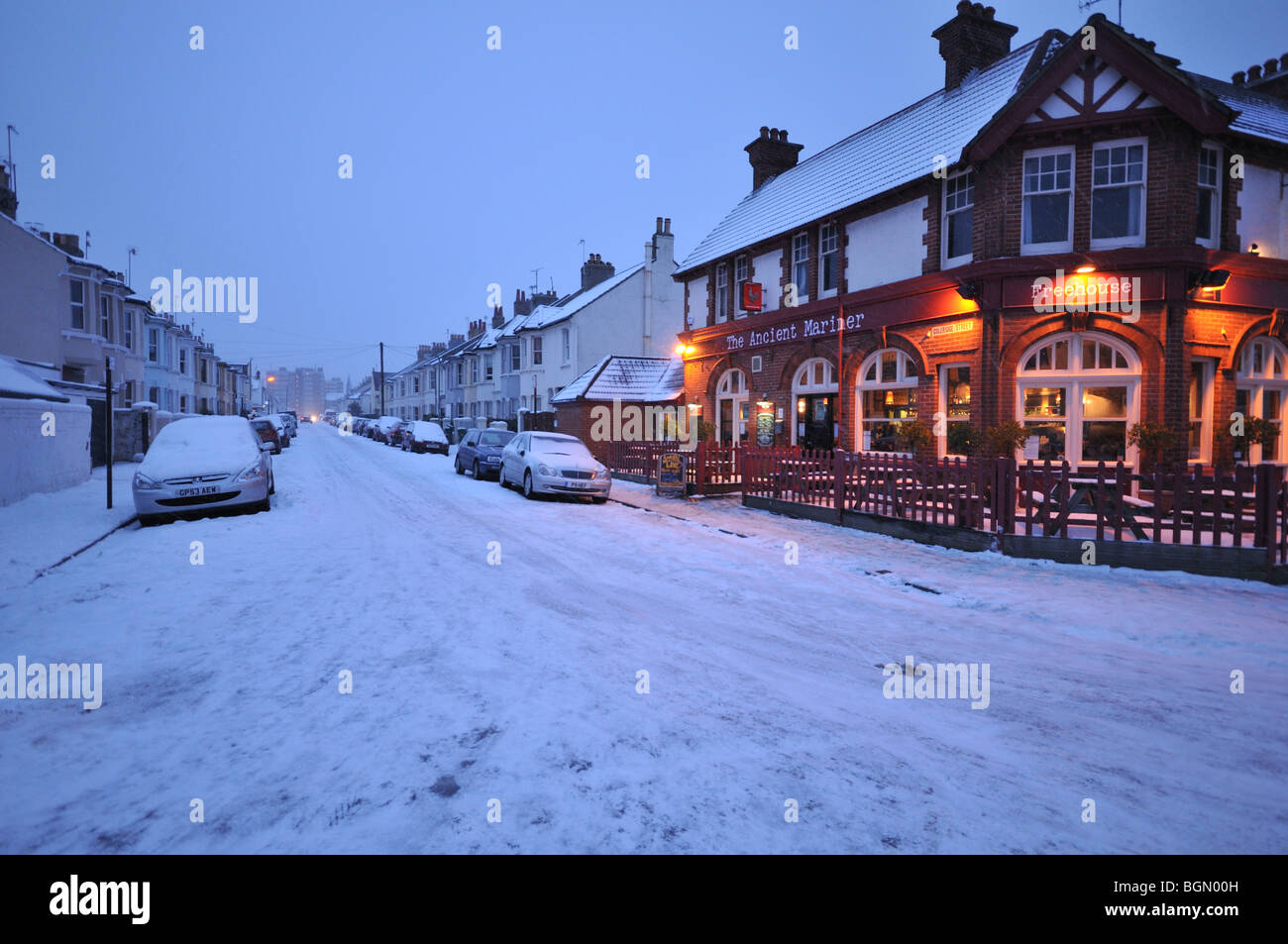 Snow on a residential street in the evening, England Stock Photo - Alamy