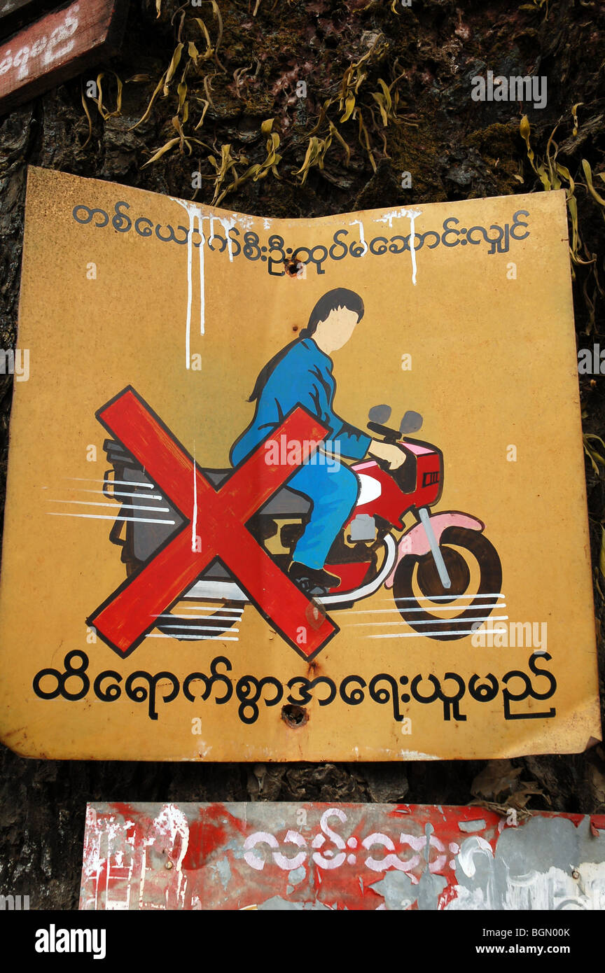 Burmese road signs and banners in Tachileik, MYANMAR Stock Photo - Alamy