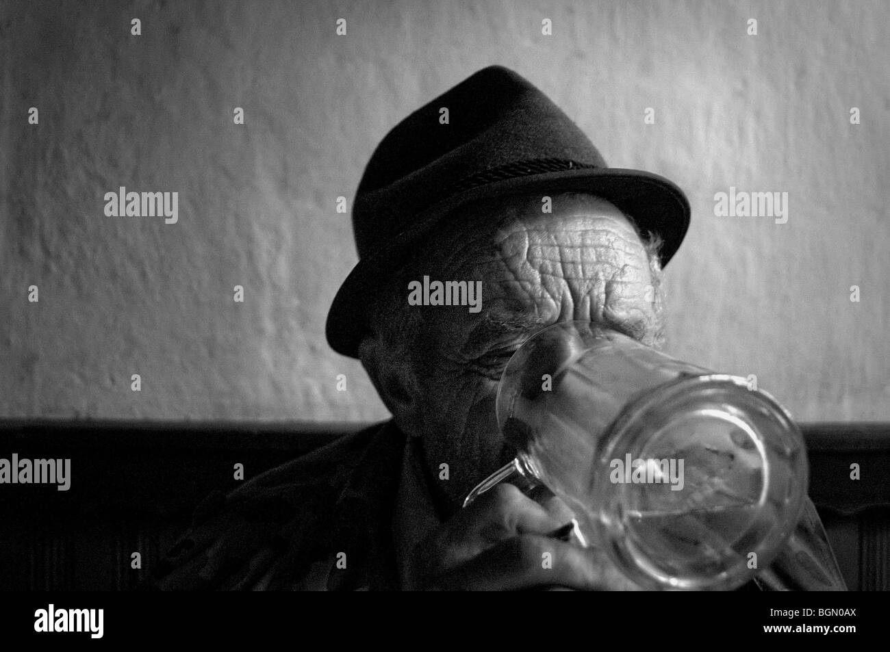 Old man drinking beer Black and White Stock Photos & Images - Alamy