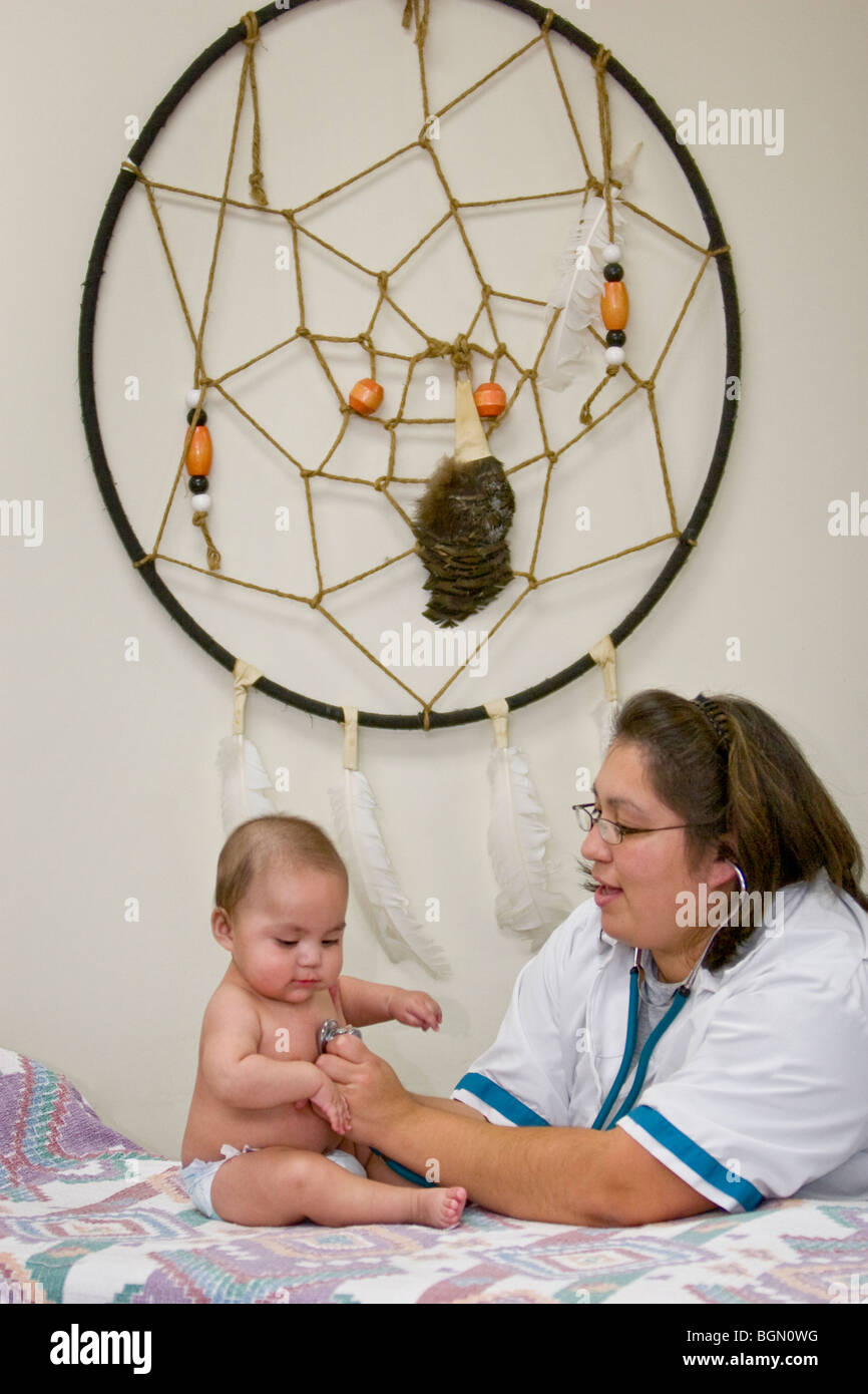 Native American nurse examines baby at Indian hospital Stock Photo - Alamy