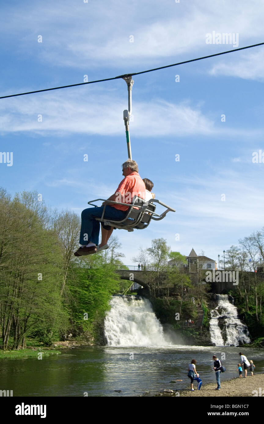 Tourists in chair lift above the river Amblève in front of the ...