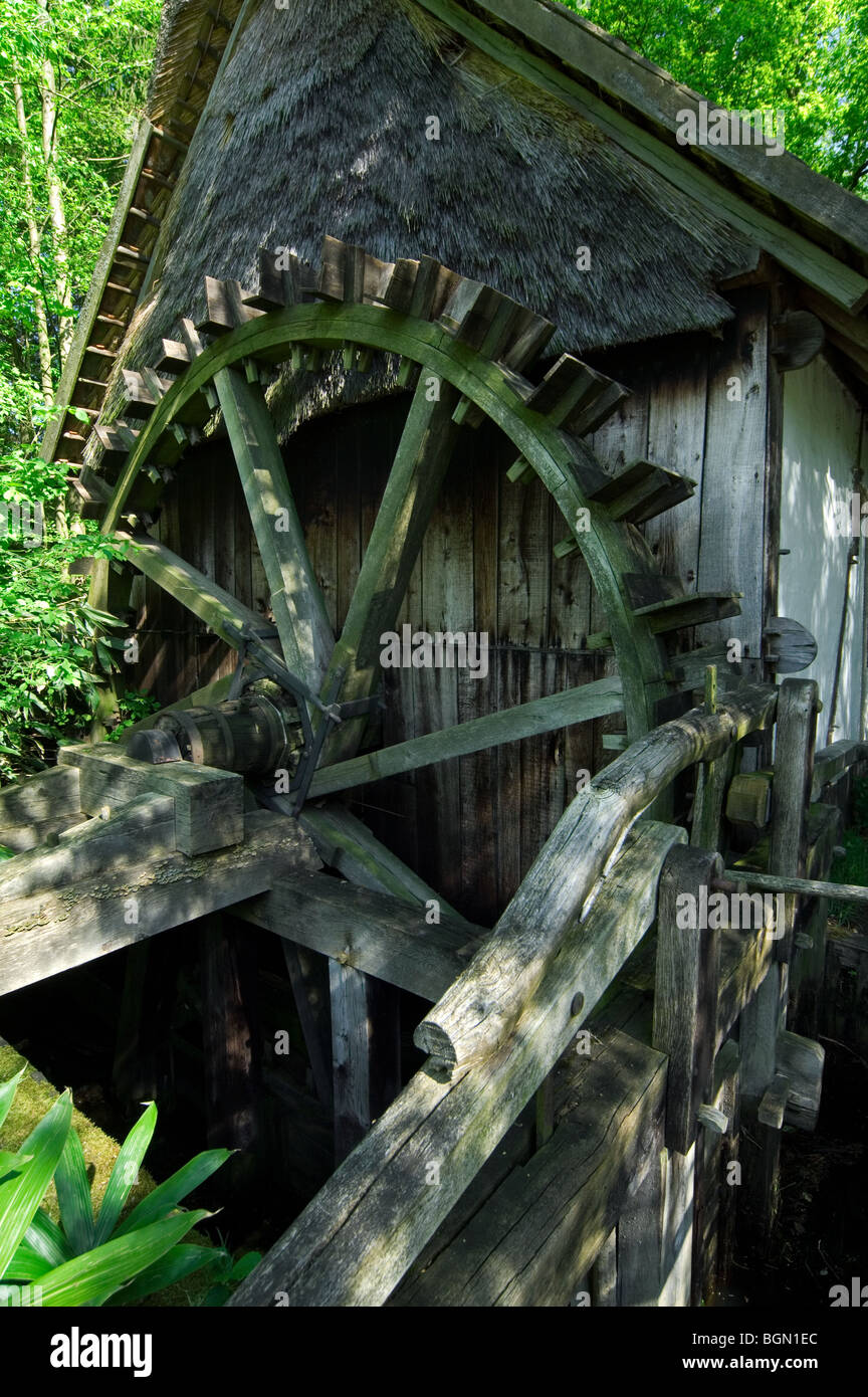 Old wooden water wheel of watermill in forest at the open air museum ...