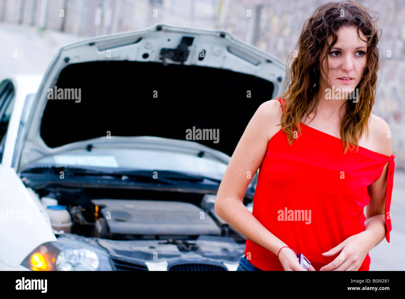 Worried woman with mechanic motor problems in car Stock Photo - Alamy