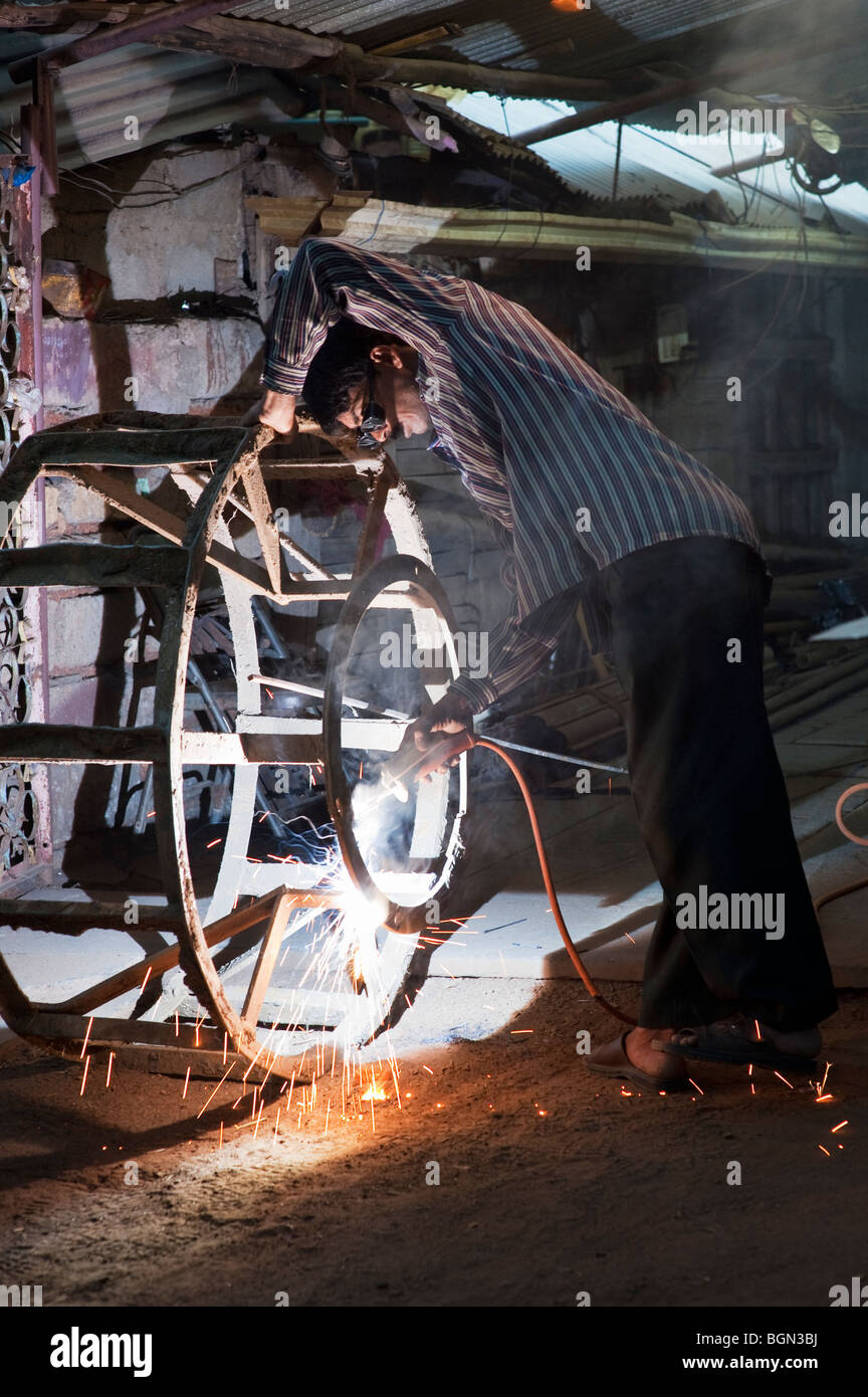 Indian man welding in a metal workshop. Andhra Pradesh, india Stock ...