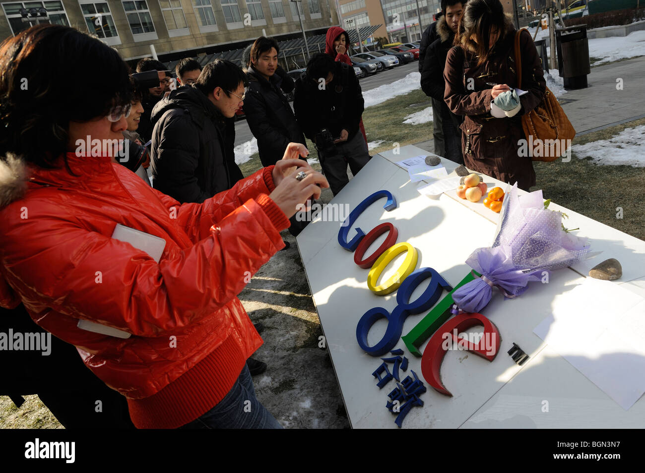 People look at the signboard of China's Google headquarters in Beijing ...