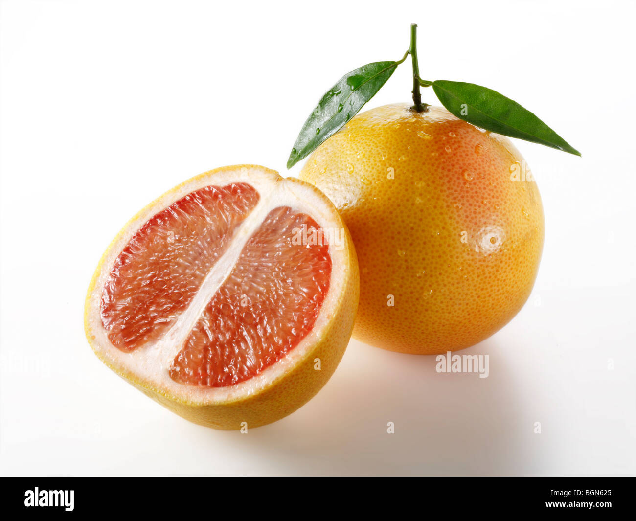 Whole and cut pink grapefruits hi-res stock photography and images - Alamy