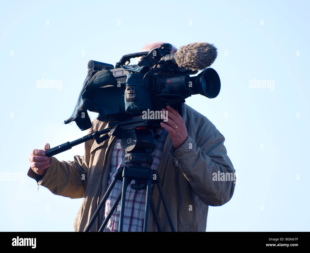 Camera man filming Stock Photo - Alamy