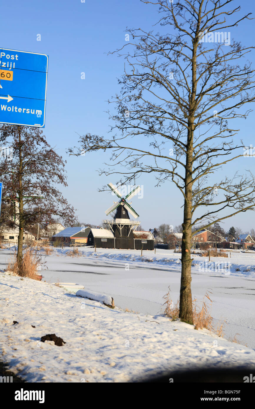 windmill in Dutch winter landscape Stock Photo - Alamy