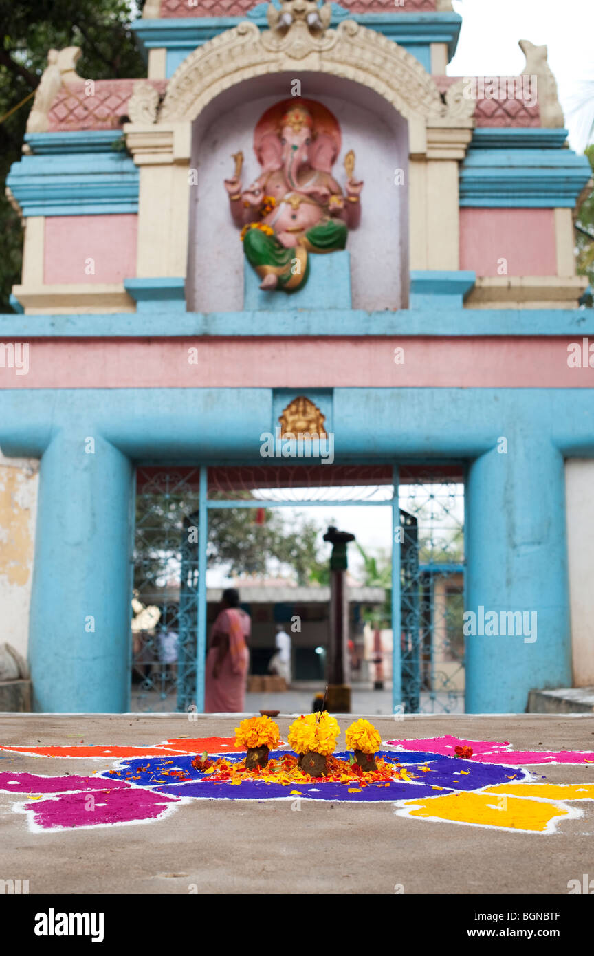 Rangoli designs in an Indian street outside a hindu temple during the ...