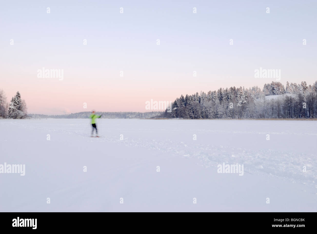 Motion blurred skier on frozen lake, Espoo, Finland Stock Photo - Alamy