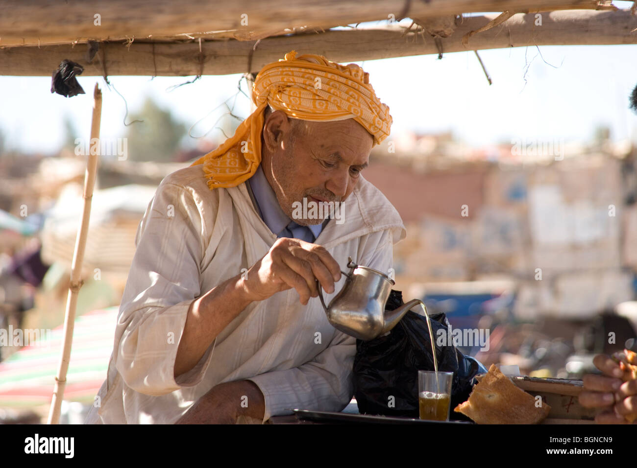 Arab man pouring tea at The Monday Market in Tinehir in the Atlas ...