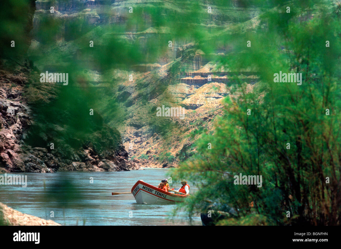 Grand Canyon dory drifting down Colorado River during summer adventure ...