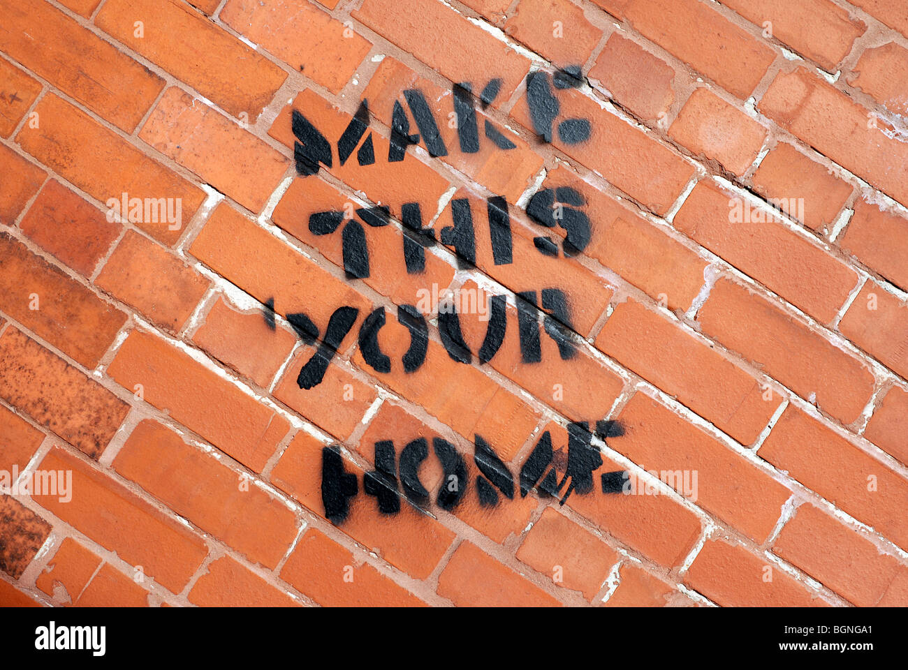 Graffiti on a wall saying 'Make This Your Home' - a pro-squatters ...