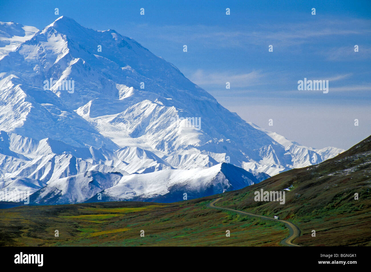 Tourist bus driving through the tundra towards Mount McKinley, Denali ...