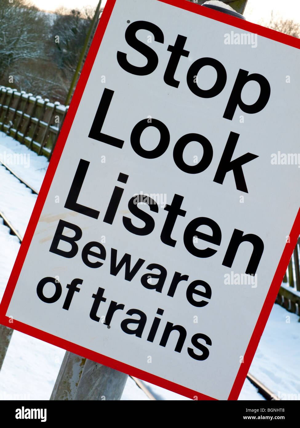 Stop Look Listen Beware of Trains warning sign on UK railway line level ...