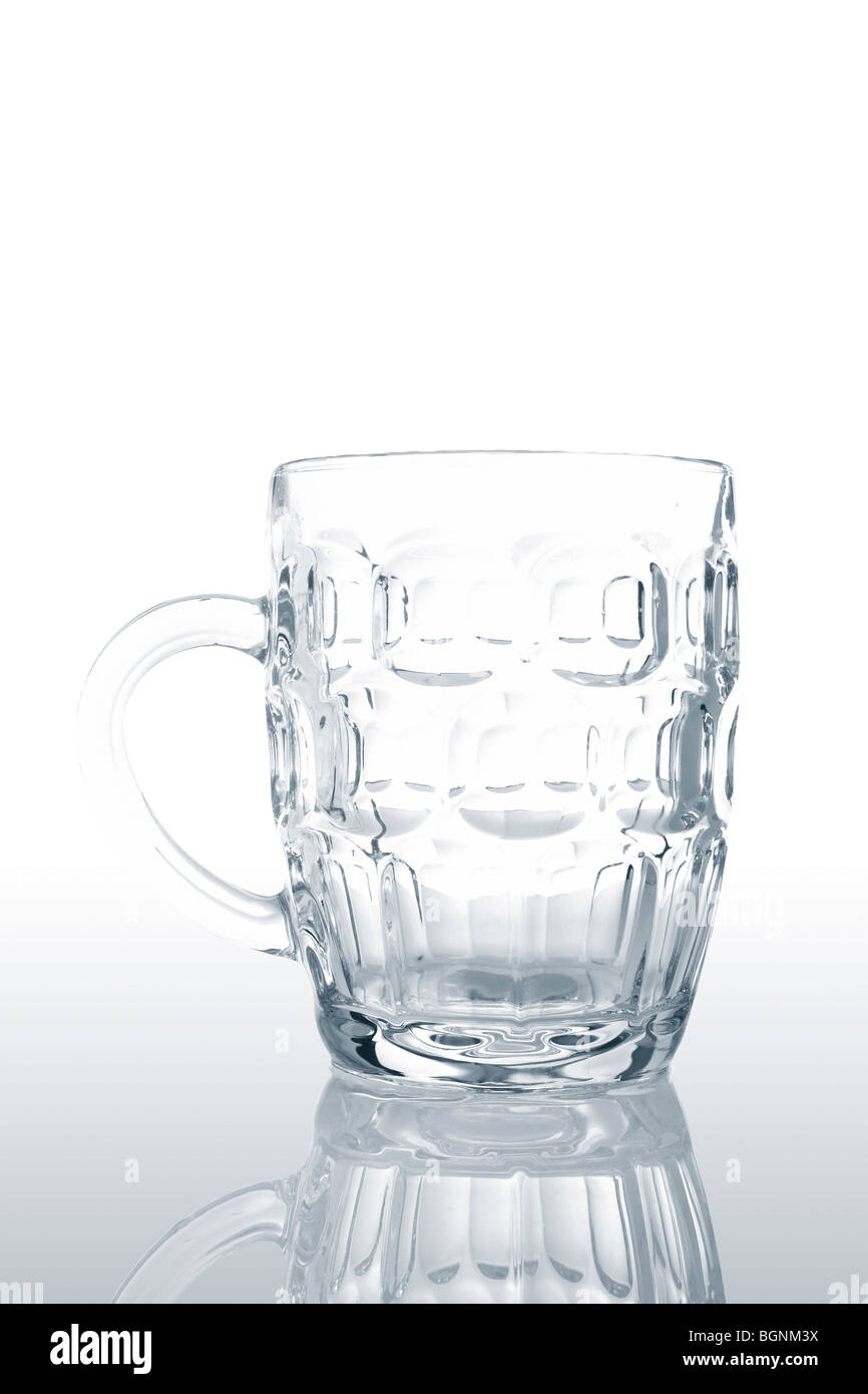 Empty pitcher reflected on a white background Stock Photo - Alamy