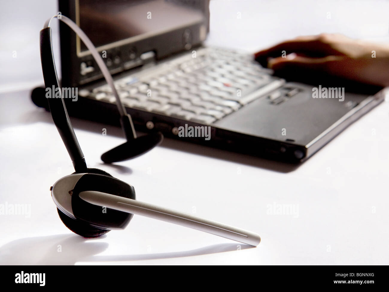 Laptop and headset Stock Photo - Alamy