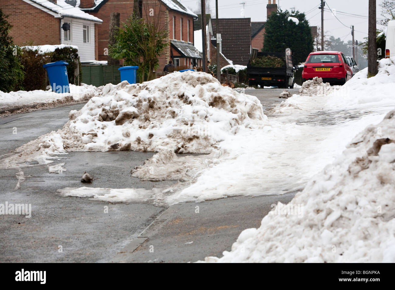 Pile of thawing dirty snow and ice on road and pavement Stock Photo - Alamy