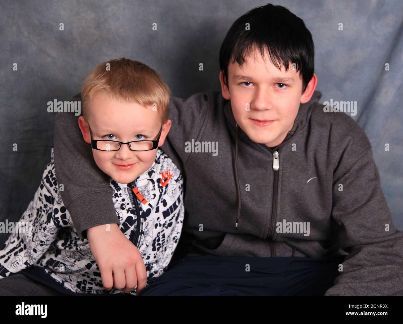 Old and younger brothers children hi-res stock photography and images ...