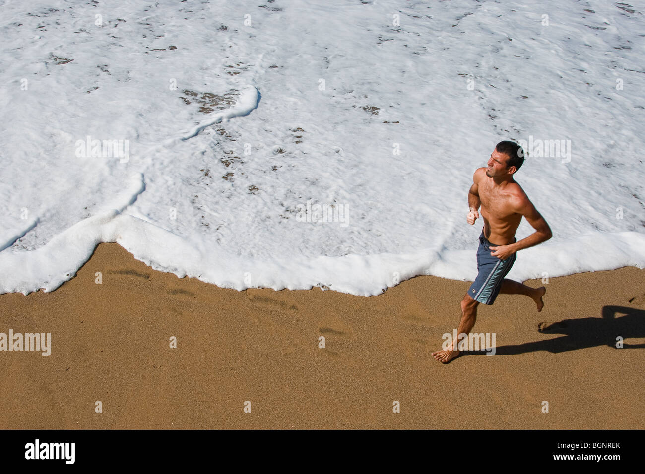 Man running from wave hi-res stock photography and images - Alamy