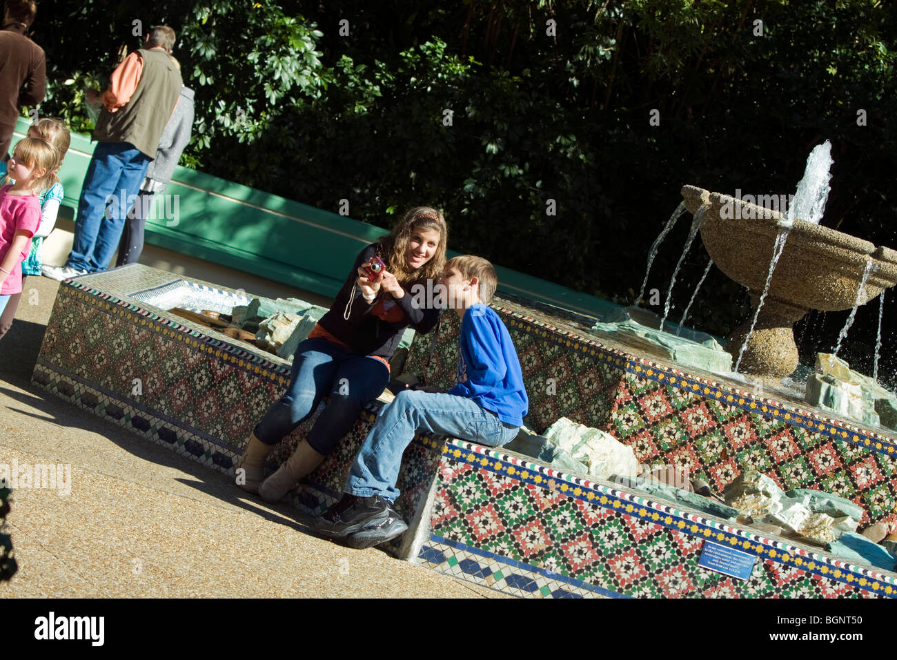 Two teenagers look at recently taken pictures Stock Photo - Alamy