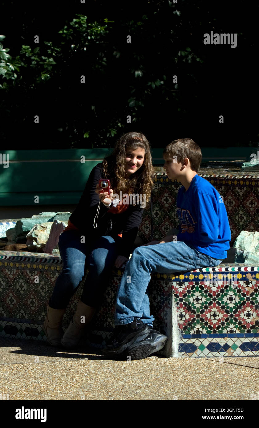Two teenagers look at recently taken pictures Stock Photo - Alamy