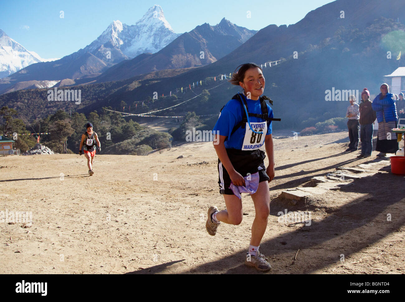 Local Nepali Woman Running In The Everest Marathon Himalayas Nepal Asia ...
