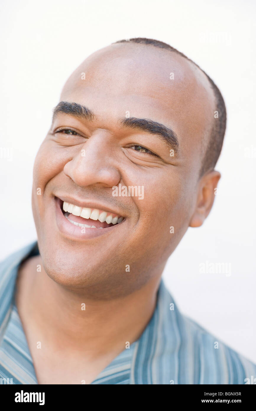 Close-up of a mid adult man smiling Stock Photo - Alamy