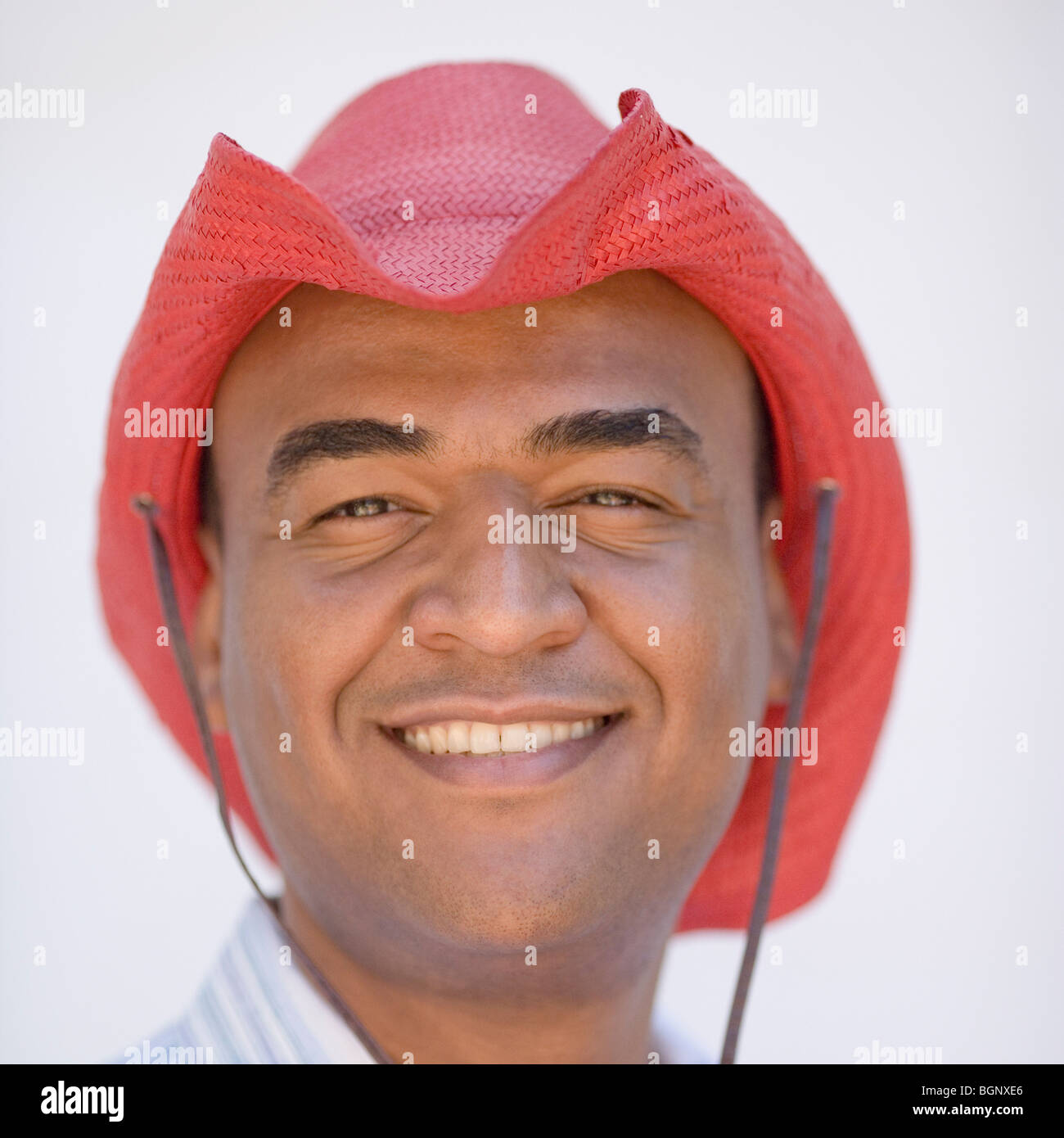 Portrait of a mid adult man wearing a cowboy hat and smiling Stock ...