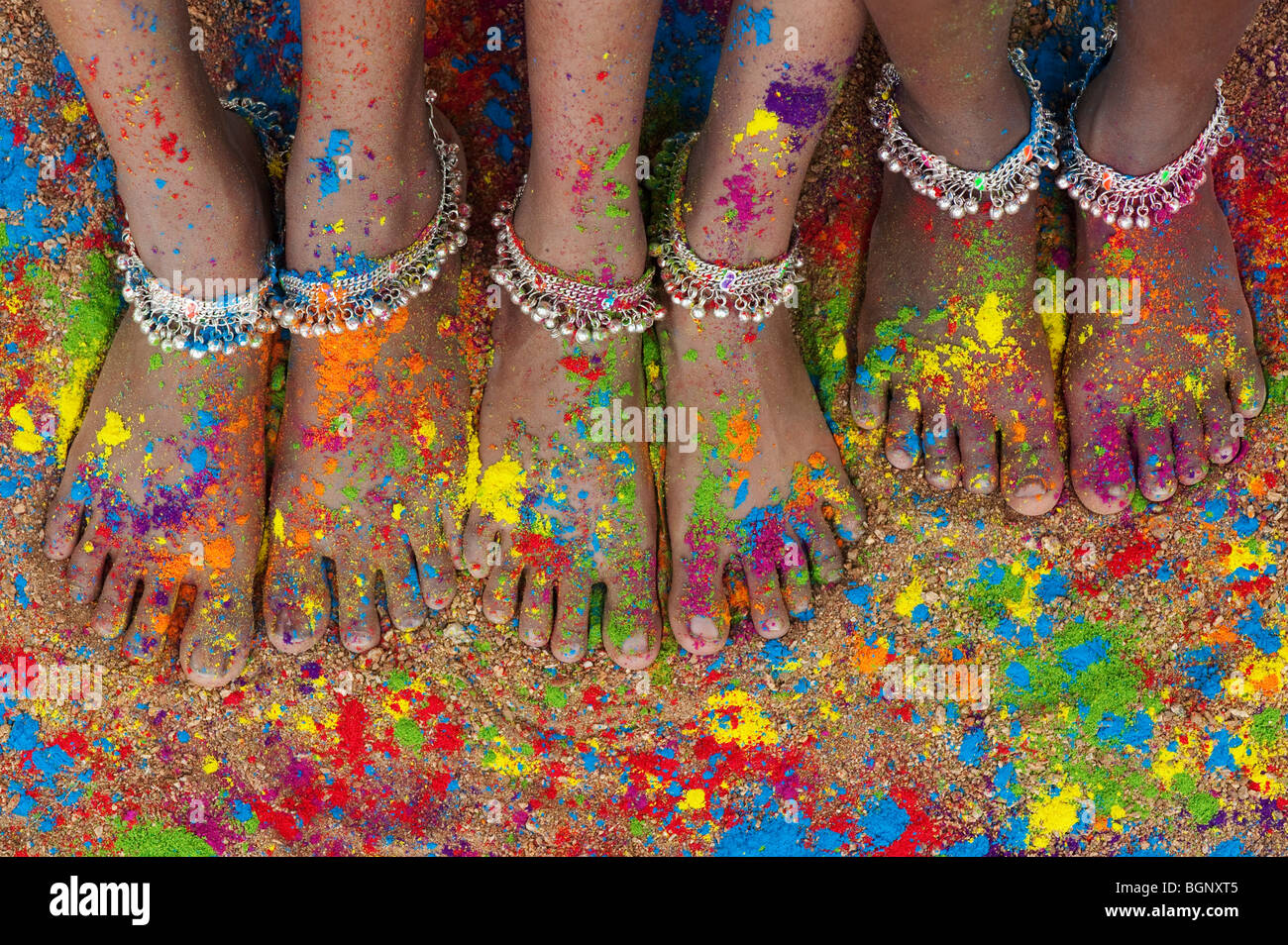 Indian girls bare feet covered in coloured powder. Andhra Pradesh ...