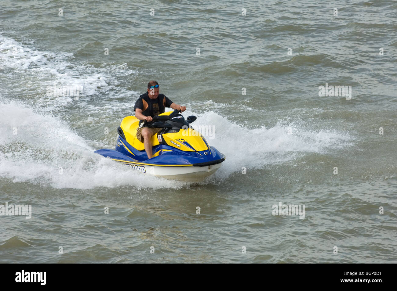 Man riding jet ski on the North Sea, Belgium Stock Photo - Alamy