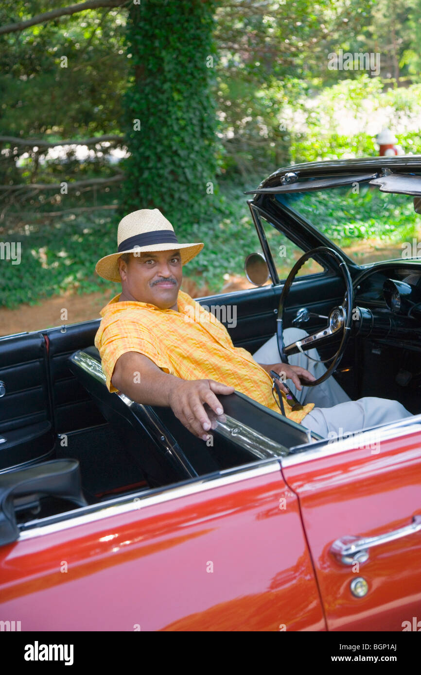 Portrait of a senior man sitting in a convertible car Stock Photo - Alamy
