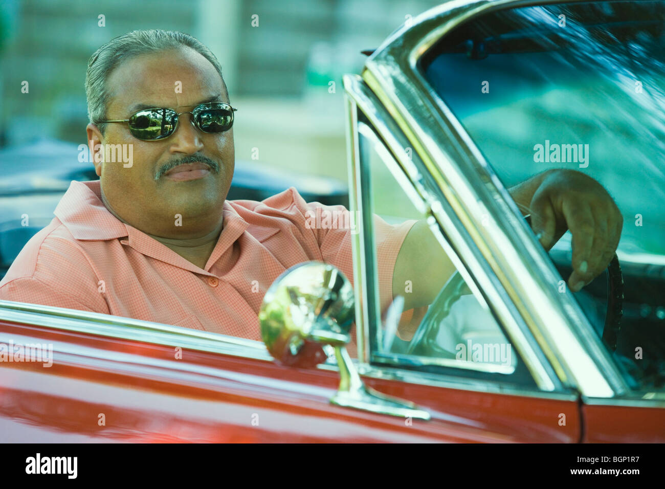 Senior man driving a convertible car Stock Photo - Alamy