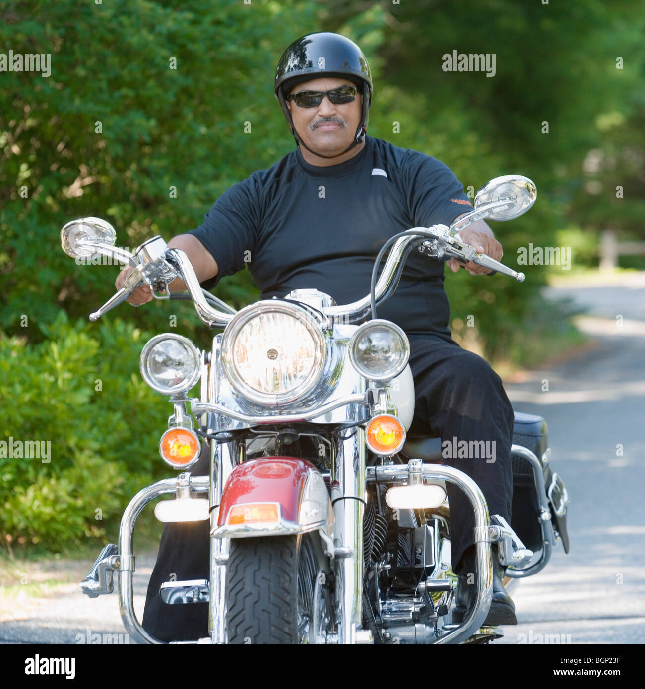 Senior man riding a motorcycle Stock Photo - Alamy