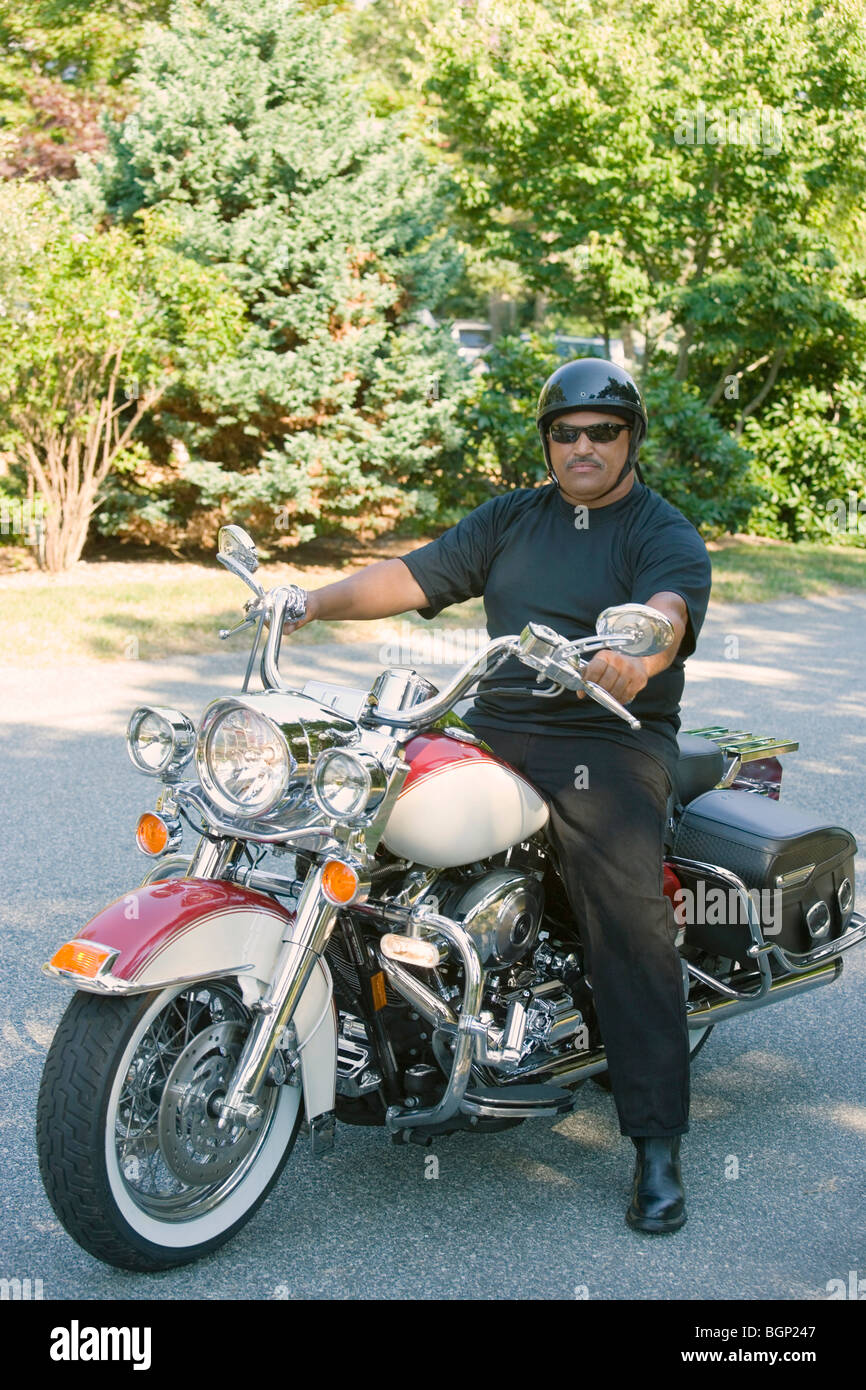 Senior man riding a motorcycle Stock Photo - Alamy