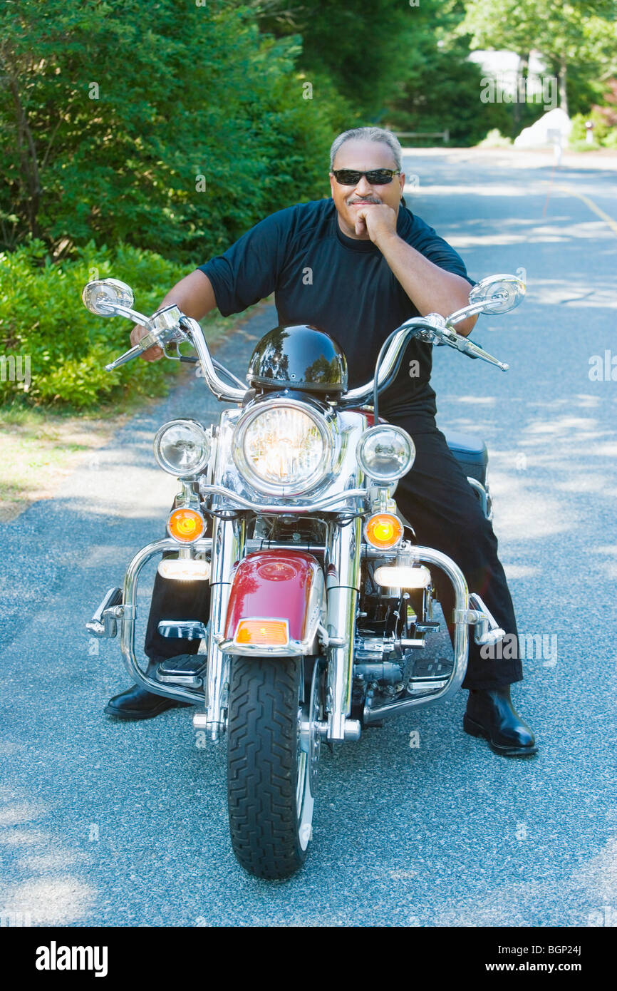 Senior man riding a motorcycle Stock Photo - Alamy