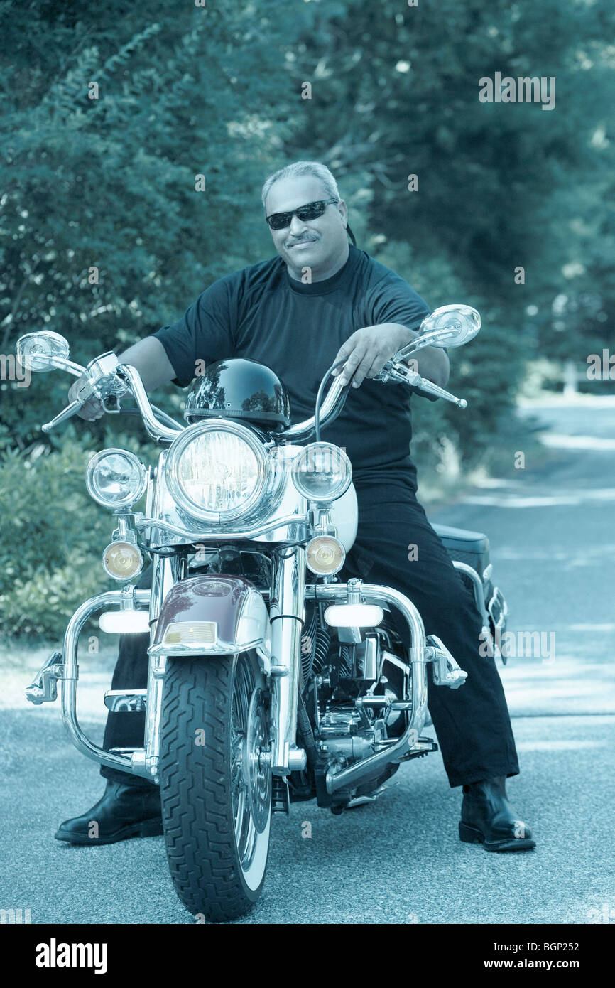 Senior man riding a motorcycle Stock Photo - Alamy