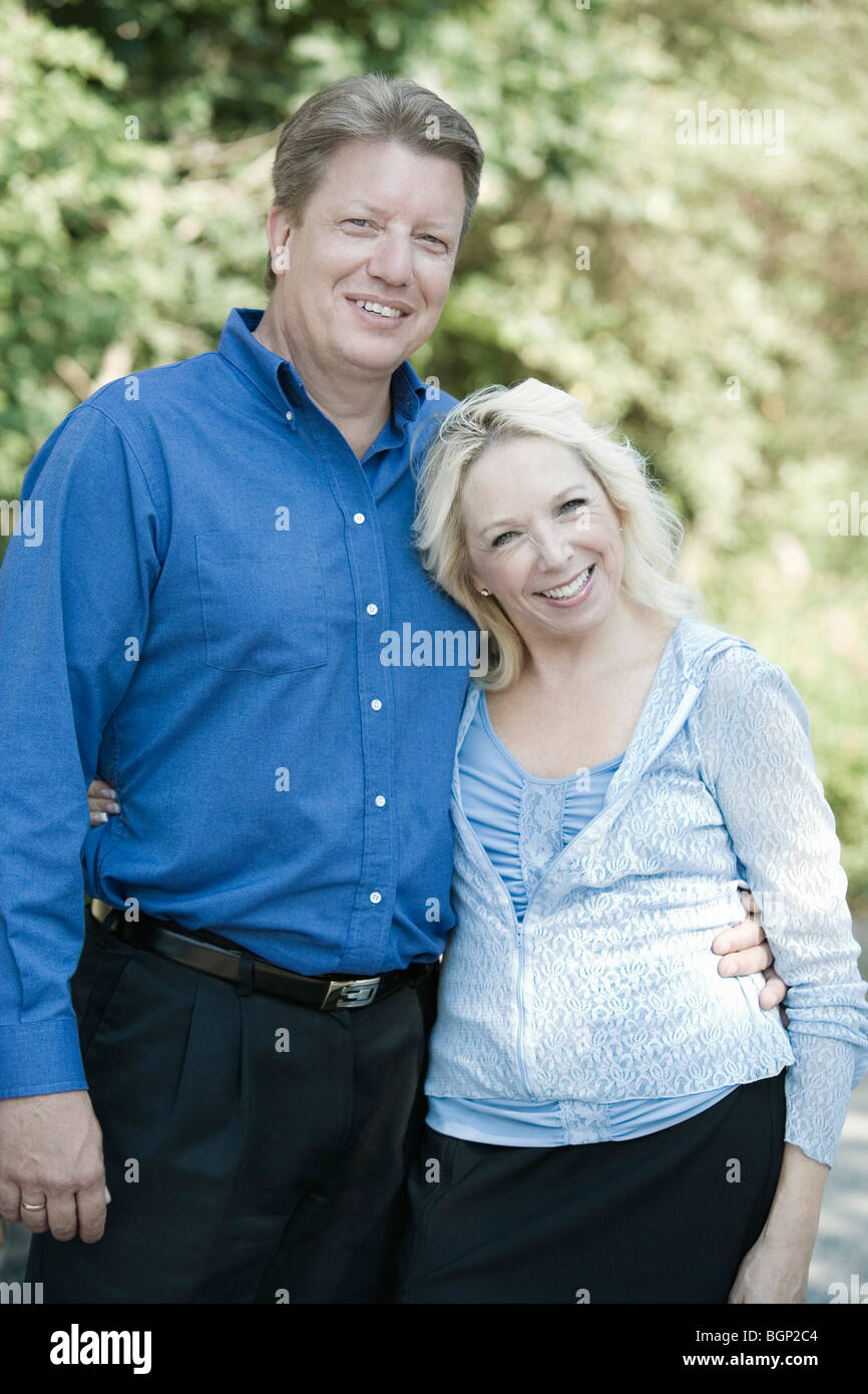 Portrait Of A Mature Couple Standing With Their Arm Around Each Other